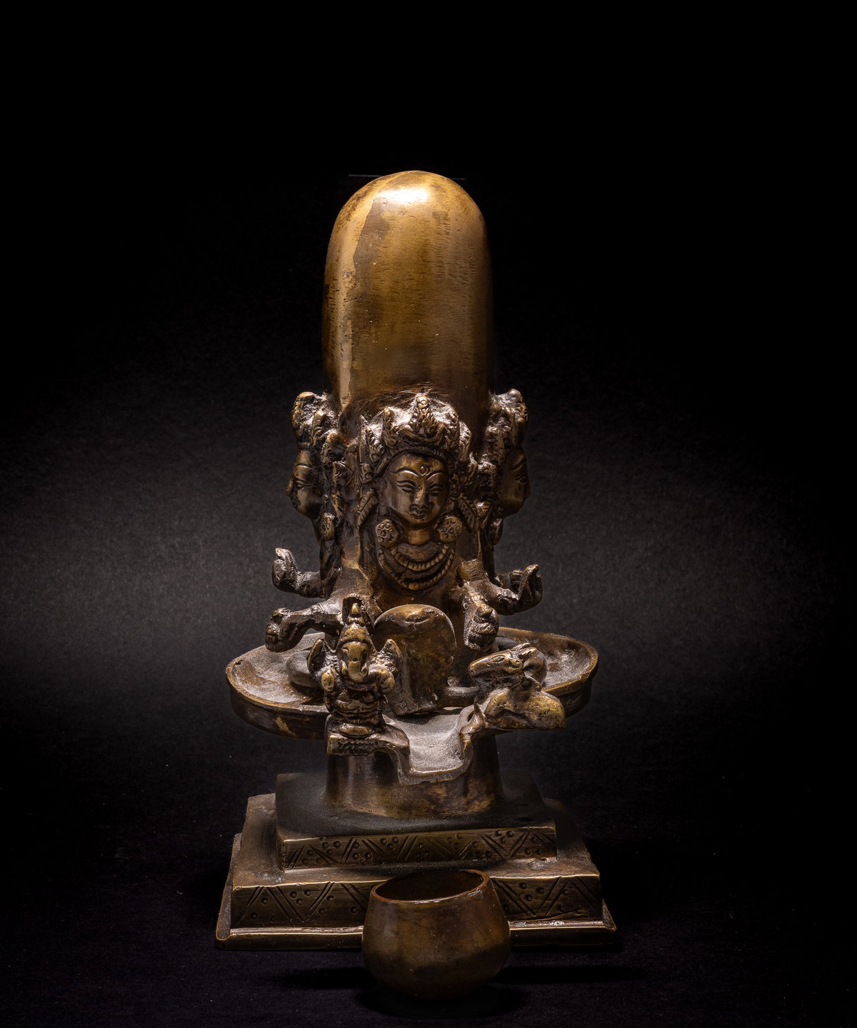 Antique Shiva Lingam statue bronze – Chaturmukha with ritual bowl